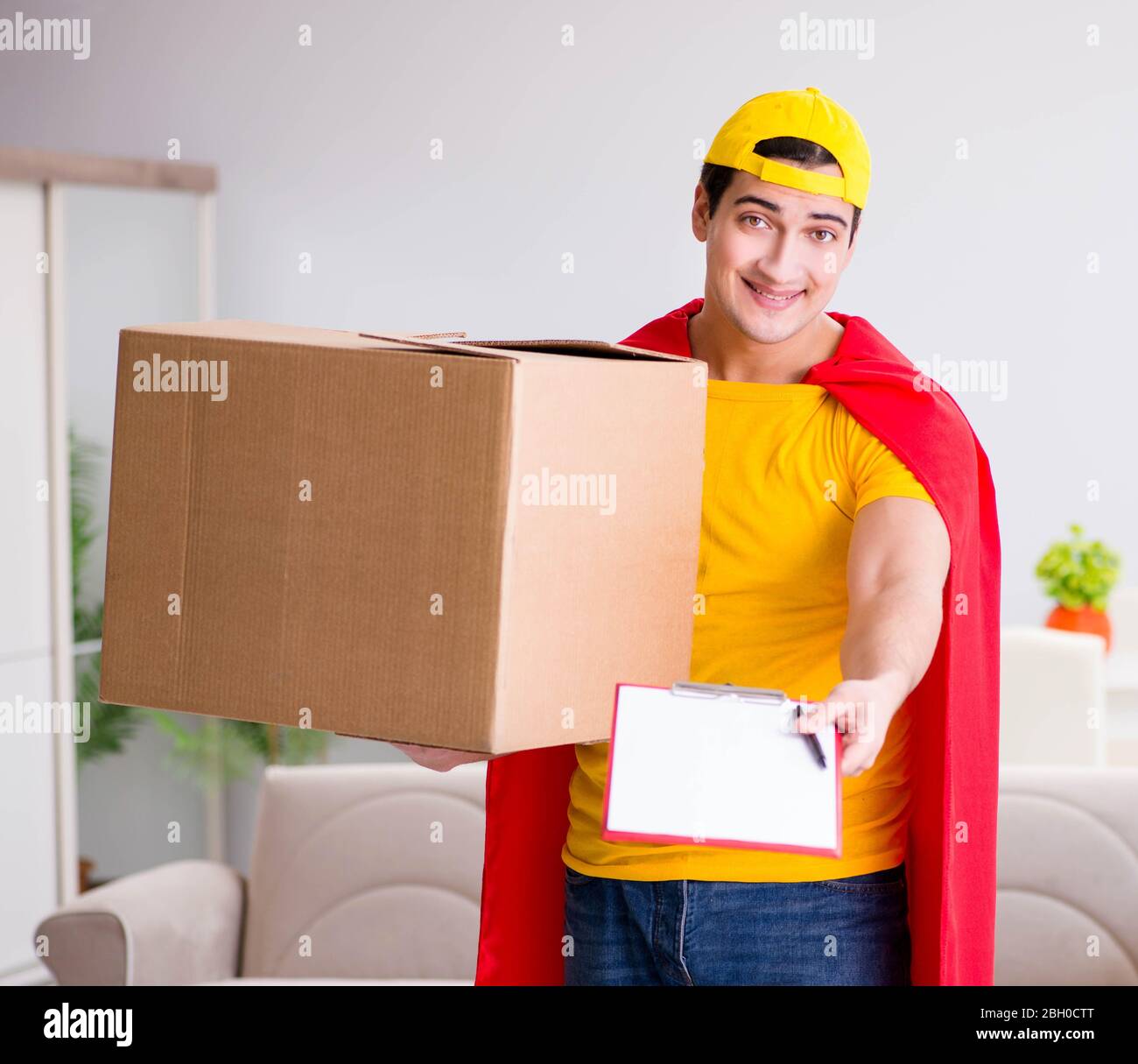 The superhero delivery guy with box Stock Photo - Alamy