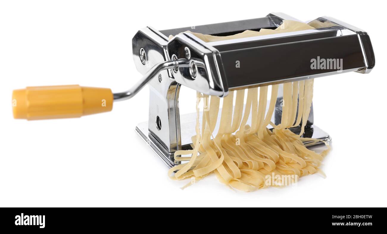 Metal pasta maker machine with dough isolated on white Stock Photo - Alamy