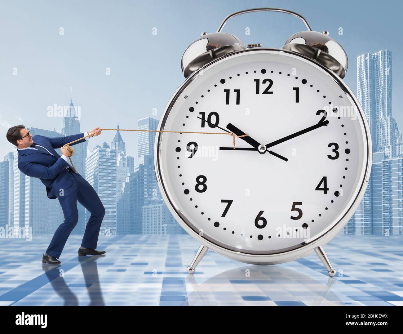 Businessman pulling clock in hi-res stock photography and images - Alamy