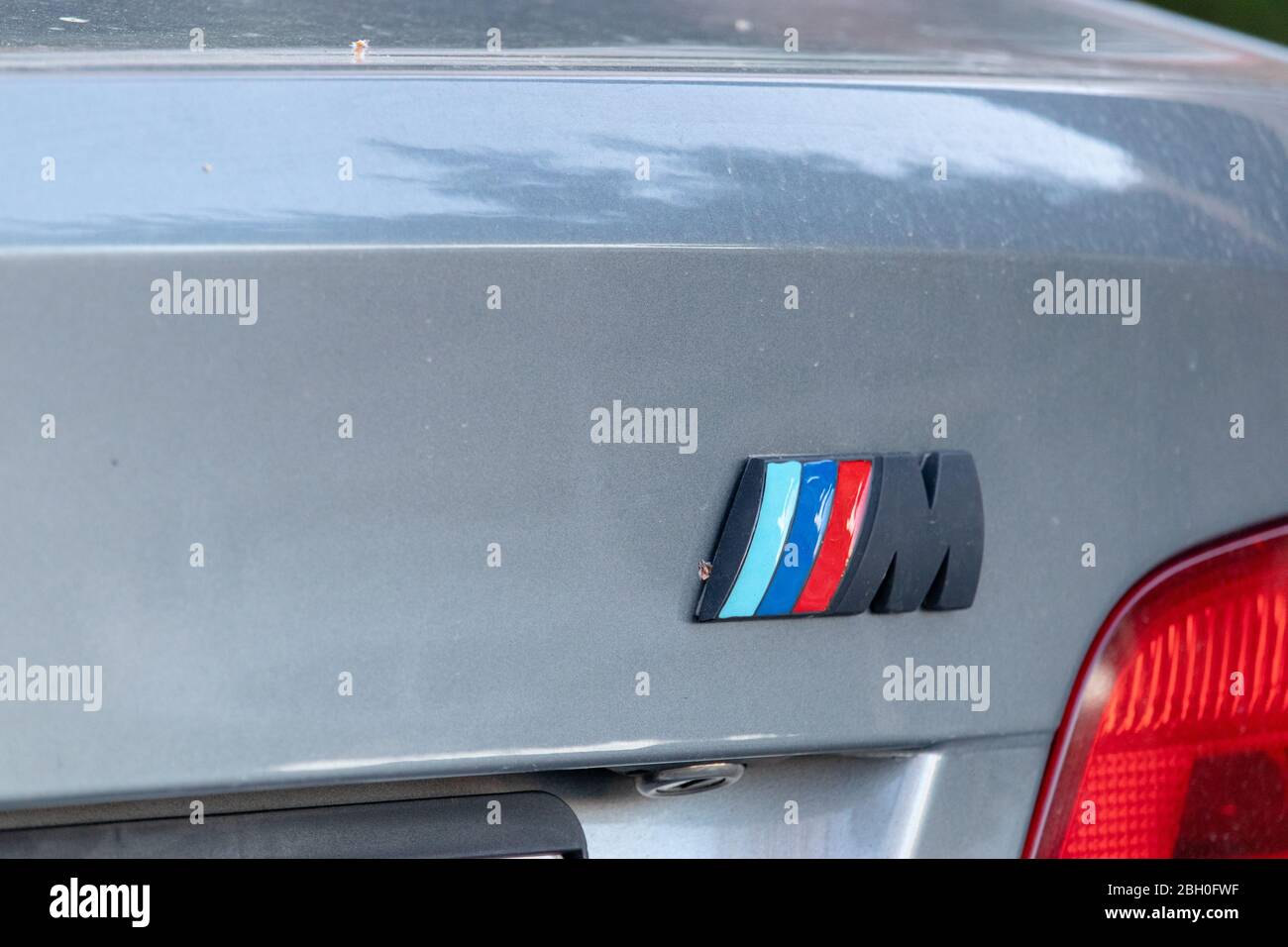 M-sport badge on the boot of a BMW E90 M5 car. Famous logo representing ...