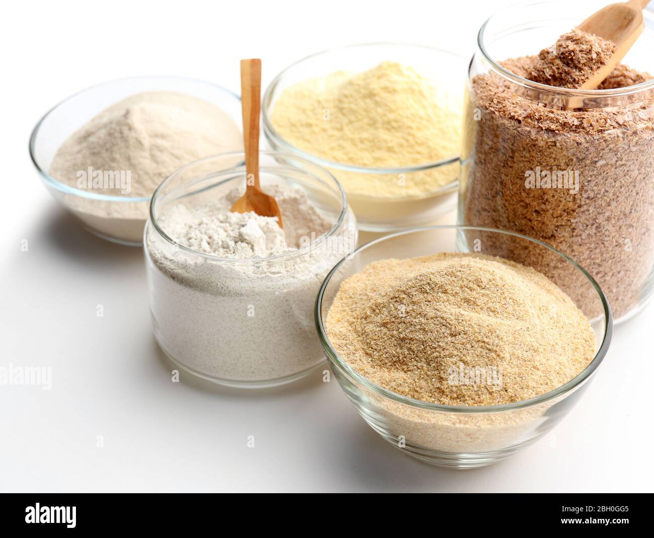 Different types of flour in bowls isolated on white Stock Photo - Alamy
