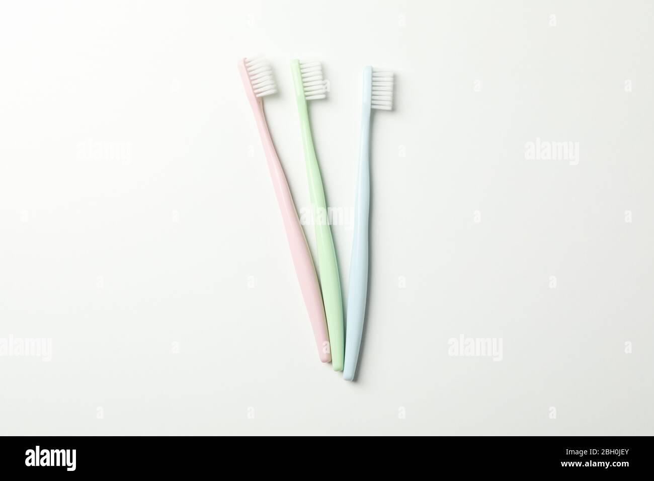 Toothbrushes on white background, top view. Dental care Stock Photo - Alamy