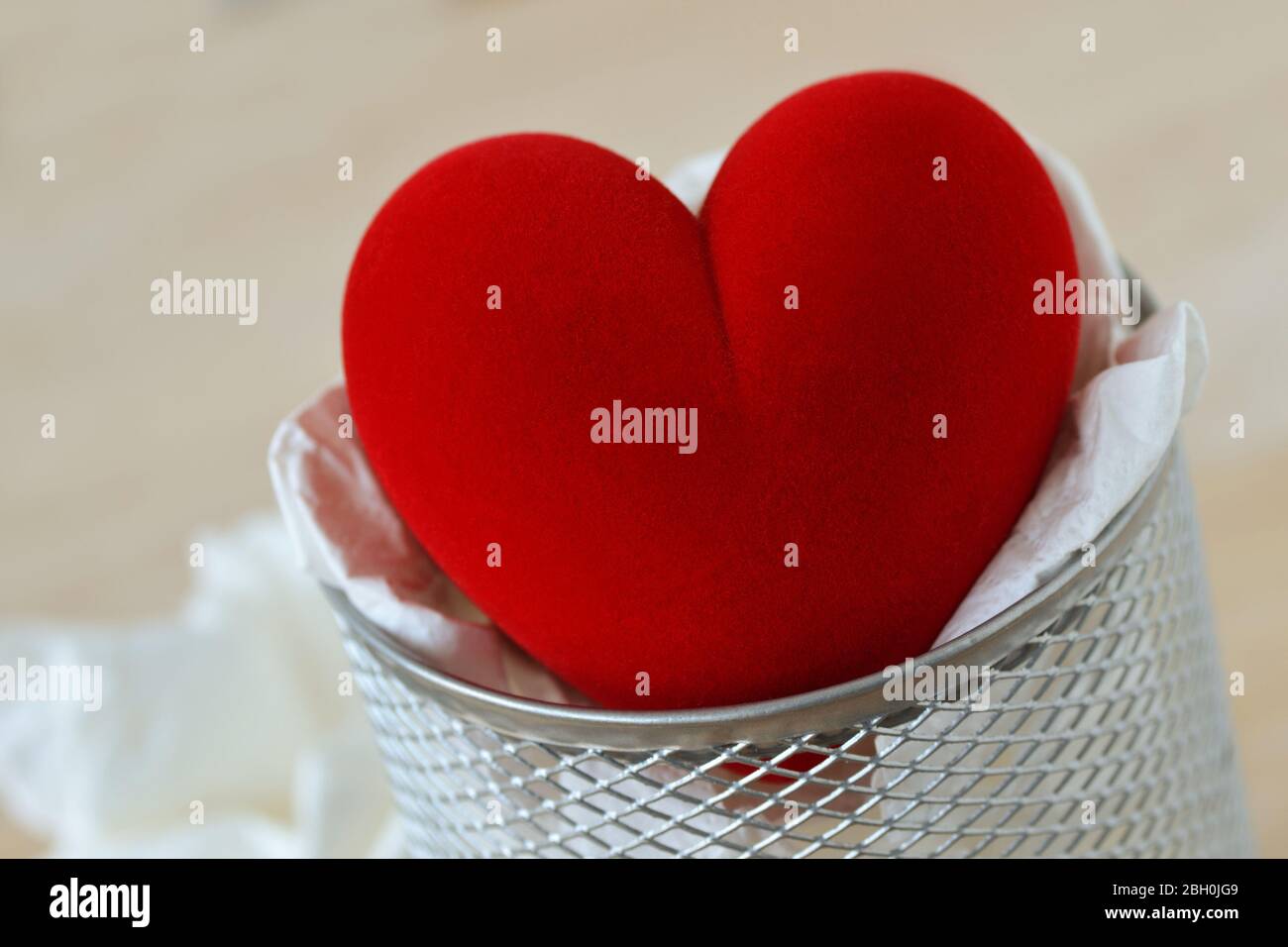 Close-up of heart in trash basket - Concept of love and suffering Stock ...