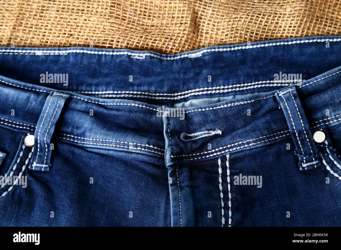 Old Blue jeans fashion design On brown hemp sack texture background ...