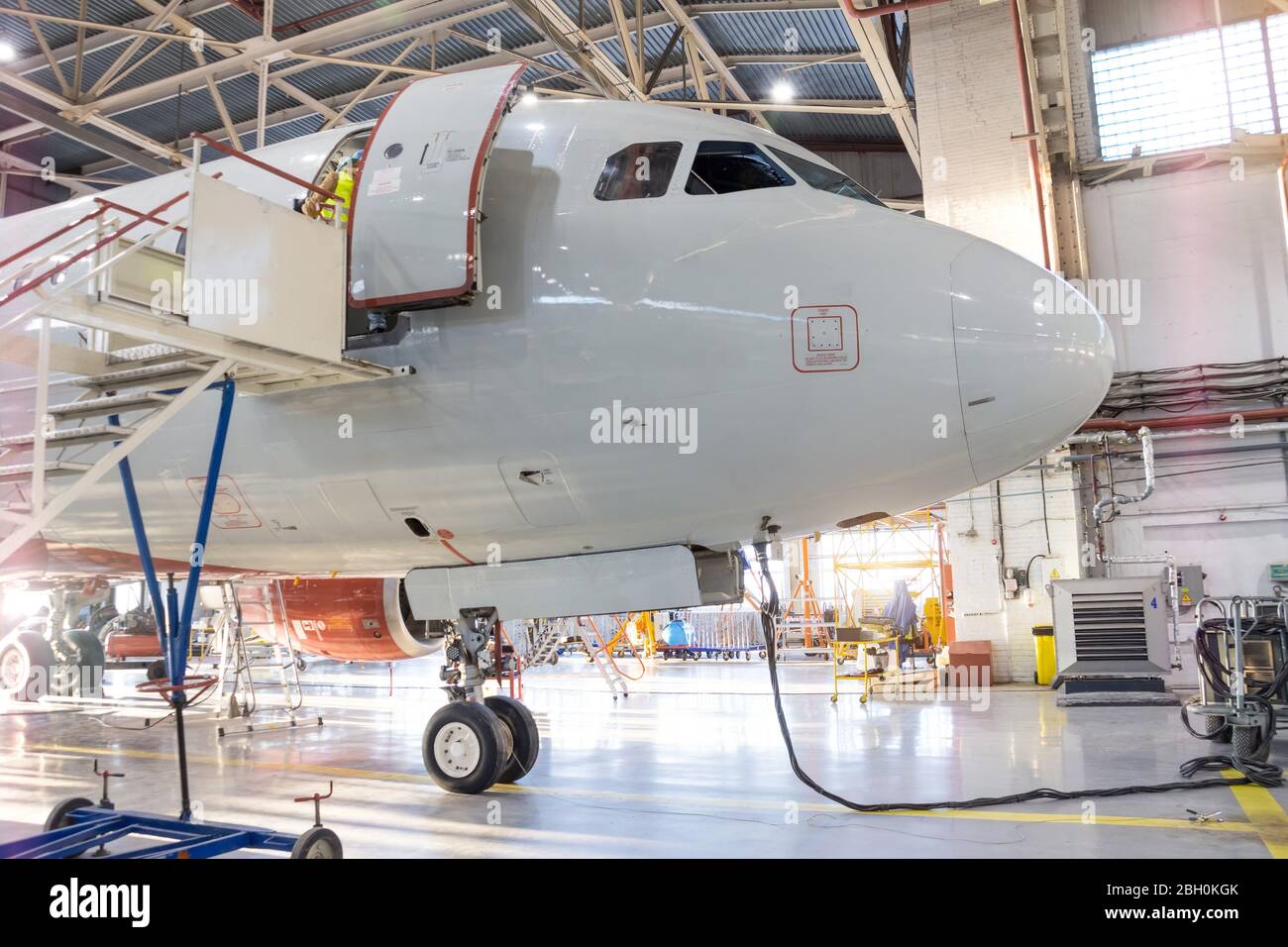 Front nose of the aircraft cockpit and front landing gear in the avia ...