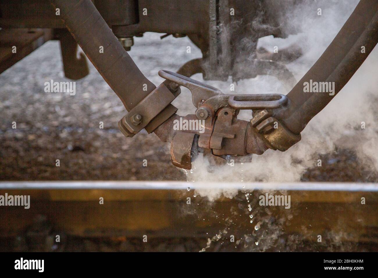 Very hot steam comes out of a pipe from an old steam railway Stock ...