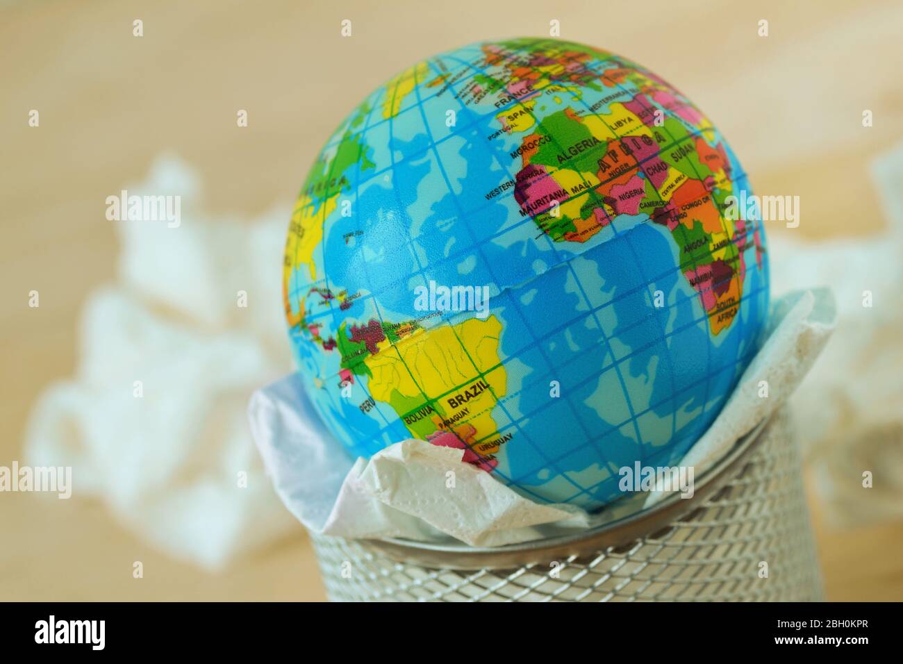 Close-up of planet earth in trash basket Stock Photo - Alamy