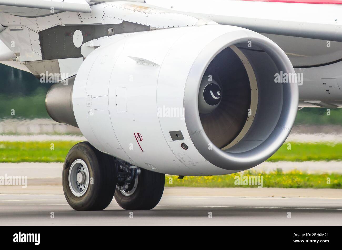 Large modern aircraft view of the huge engine and chassis, the light of ...