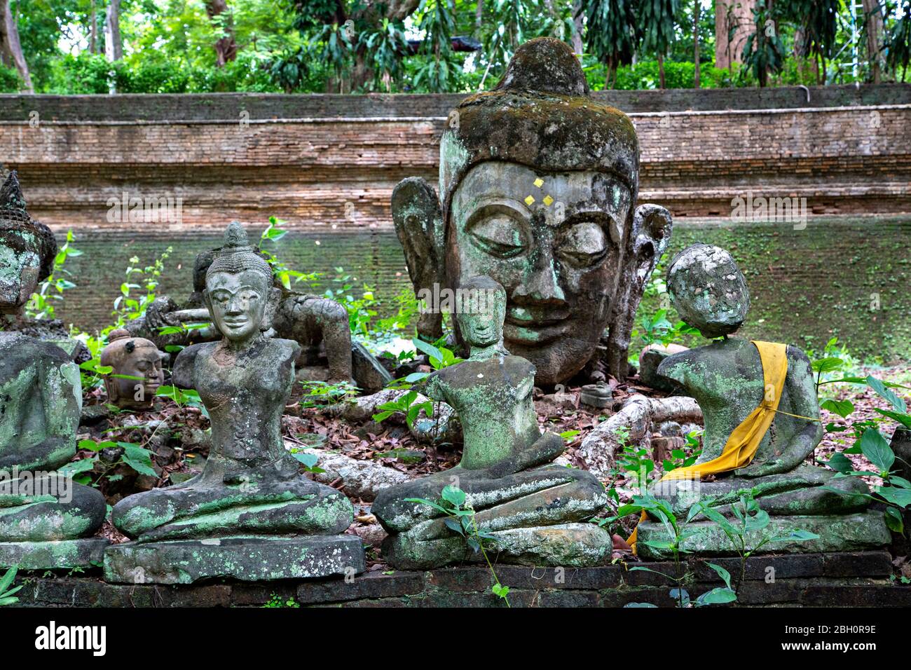 Buddha statues in the garden of the temple known as Wat Umong, in ...