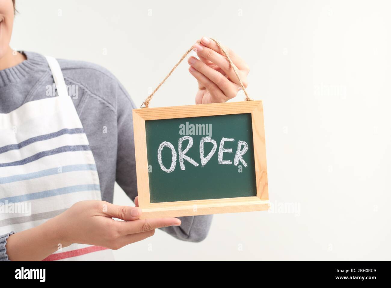 Waitress holding the chalkboard order sign on white background Stock ...
