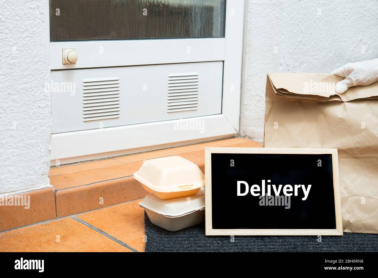 home delivery service, boxes standing by the house doors Stock Photo ...