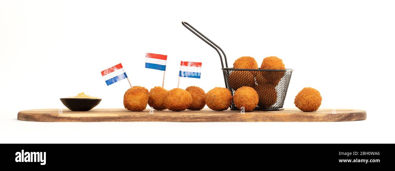 Dutch traditional snack bitterbal on a serving board, isolated Stock ...