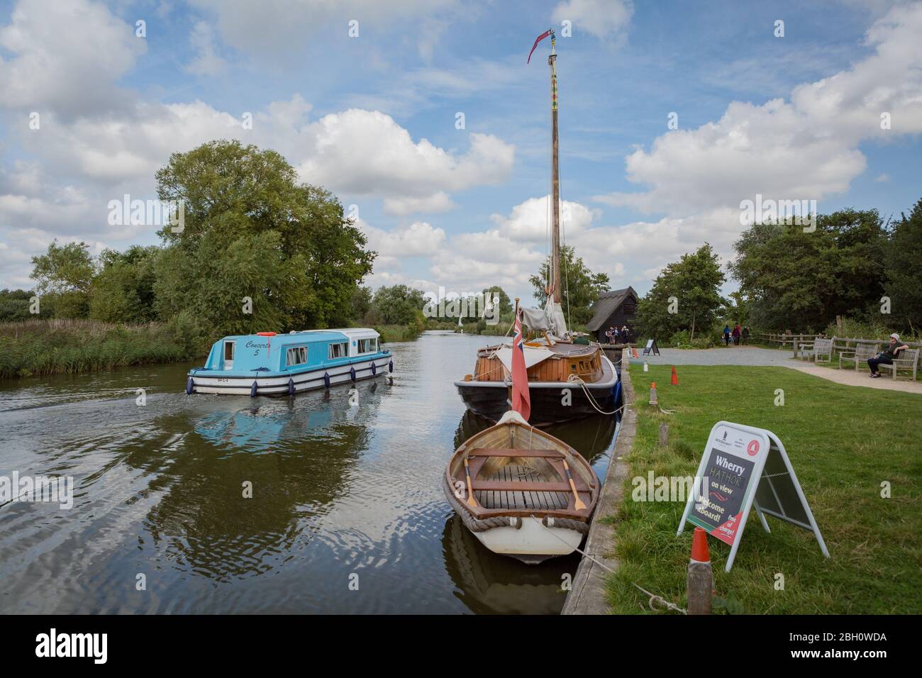 Norfolk Broads boat cruising past a traditional yacht on the Norfolk ...
