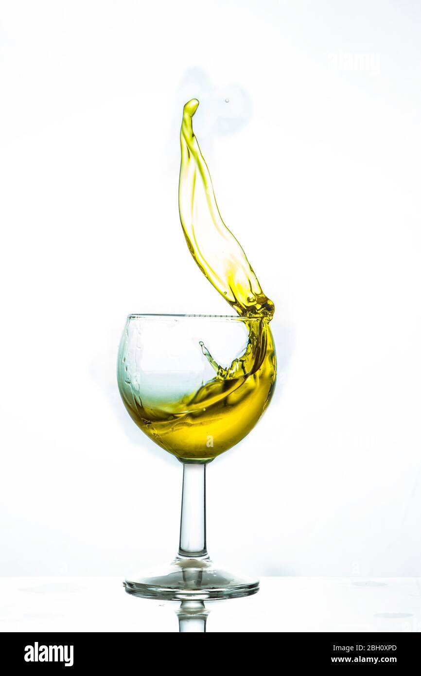 splash of liquor drink with white background Stock Photo - Alamy