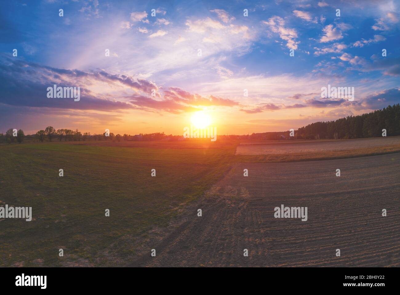 Spring rural landscape in the evening with beautiful sky, aerial view ...