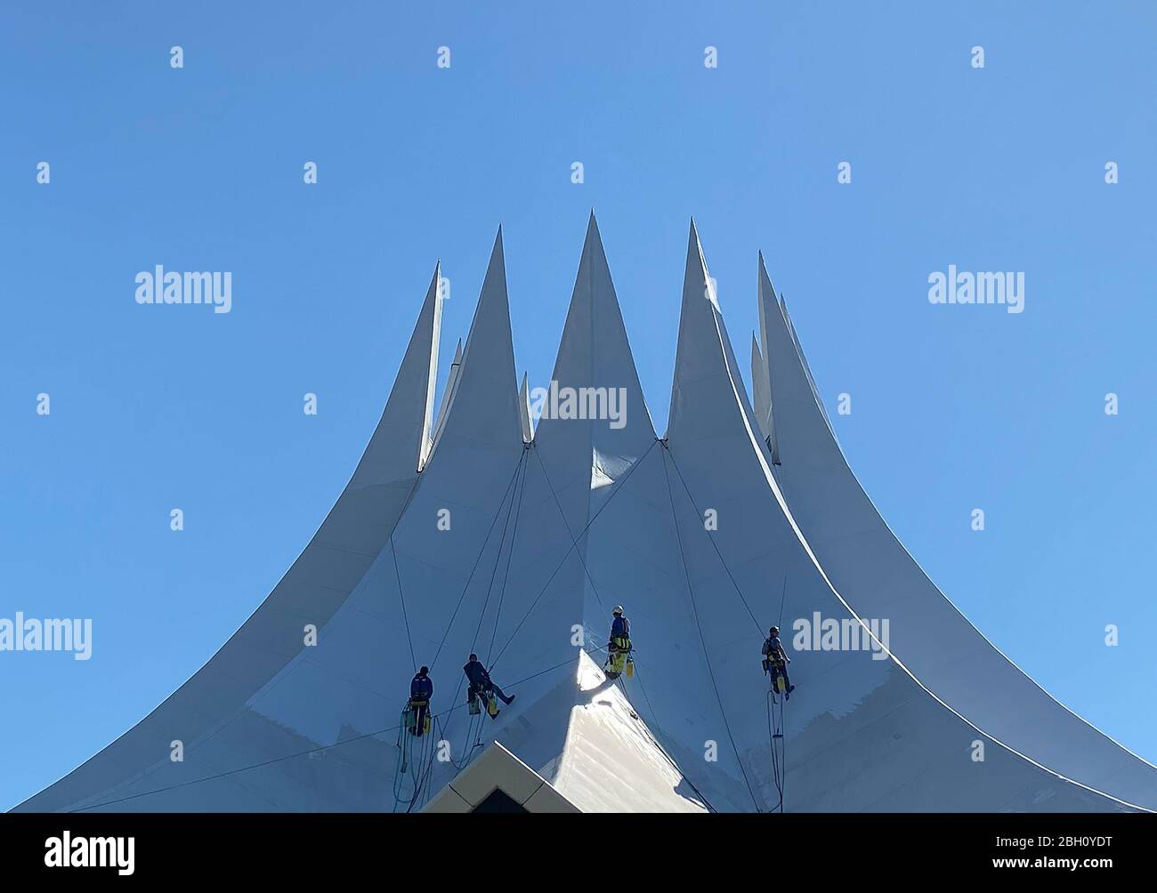 Berlin, Germany. 22nd Apr, 2020. Workers are cleaning the roof of the ...