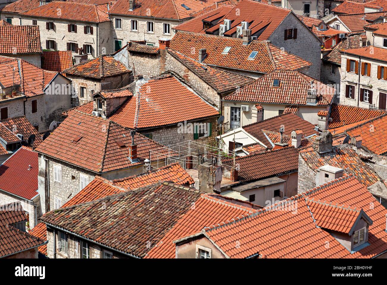 Red roof tops of the medieval houses in the old town of Kotor ...