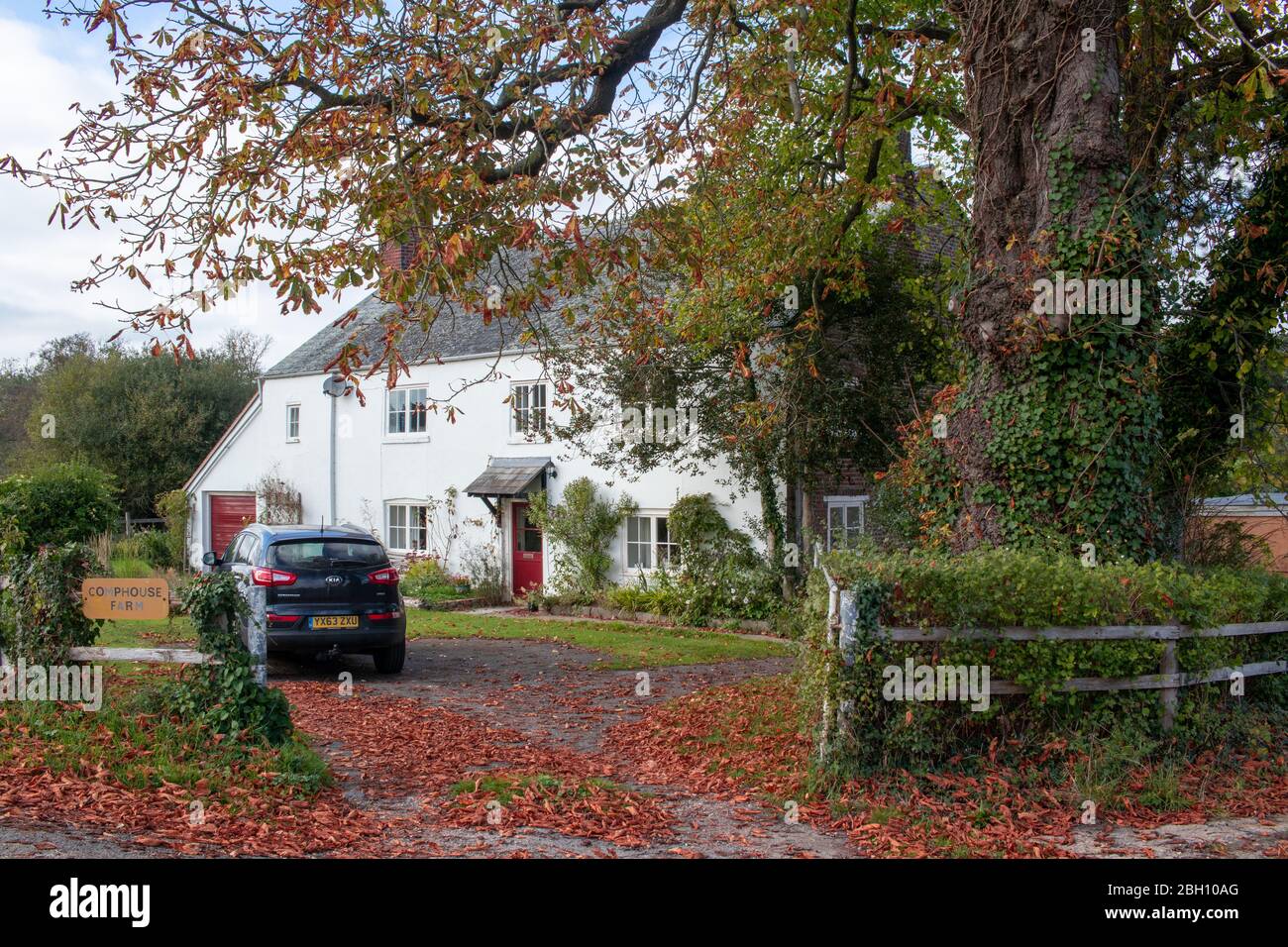 The exterior of a typical English country cottage in Autumn or fall ...