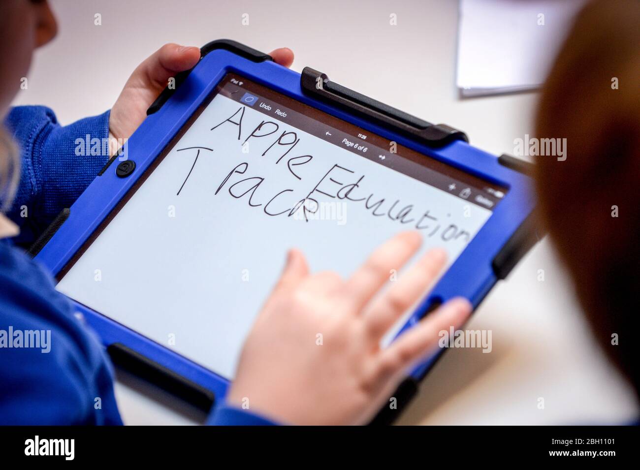 Ipads school uniform hi-res stock photography and images - Alamy