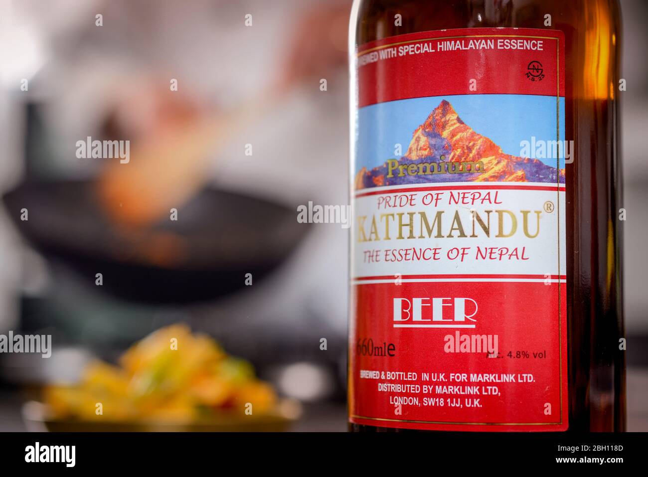 A chef prepares Nepalese dishes in a kitchen. Pride of Nepal Kathmandu ...