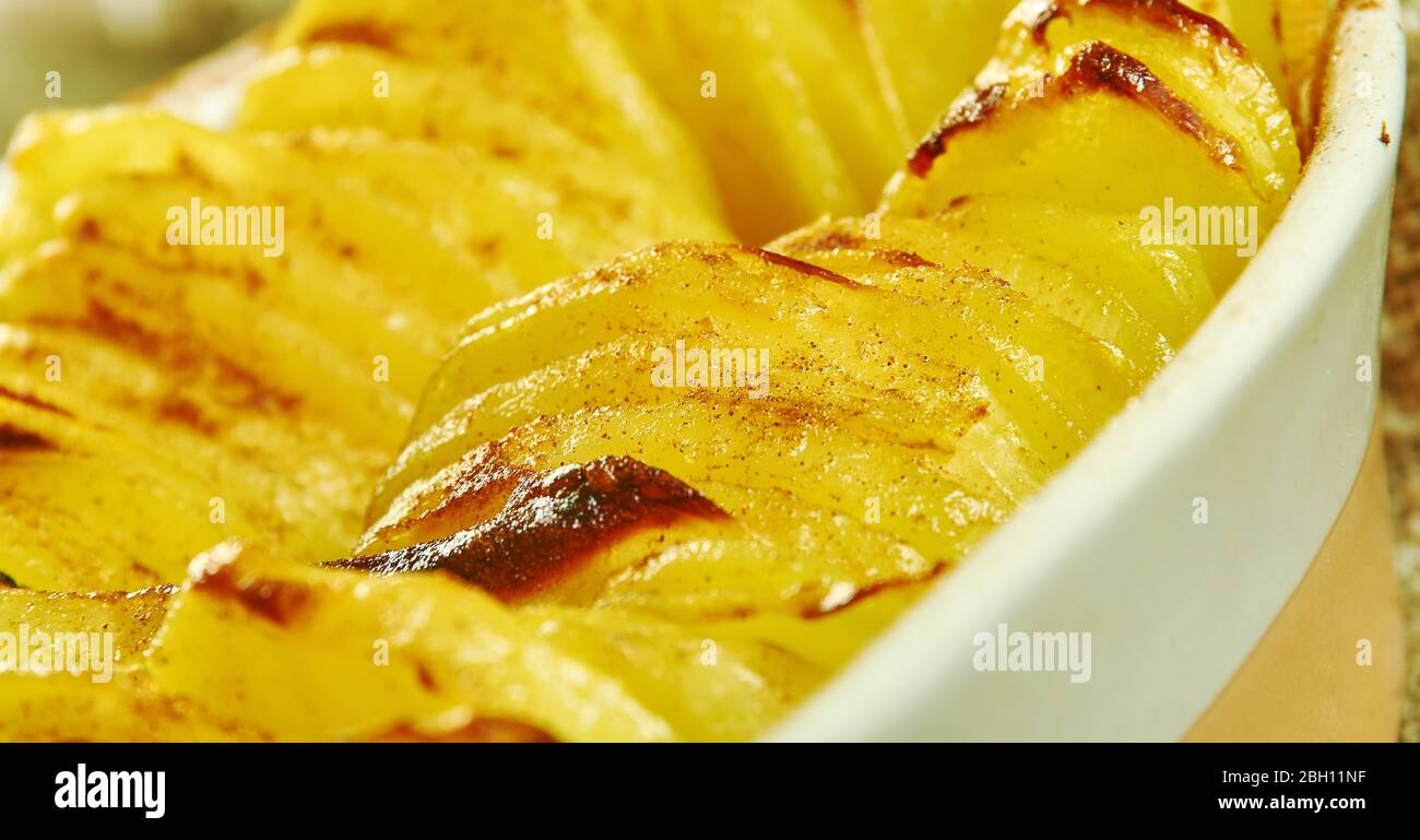 Crispy Leaf Potatoes -Best Roasted Potatoes Ever, sliced potatoes in a ...