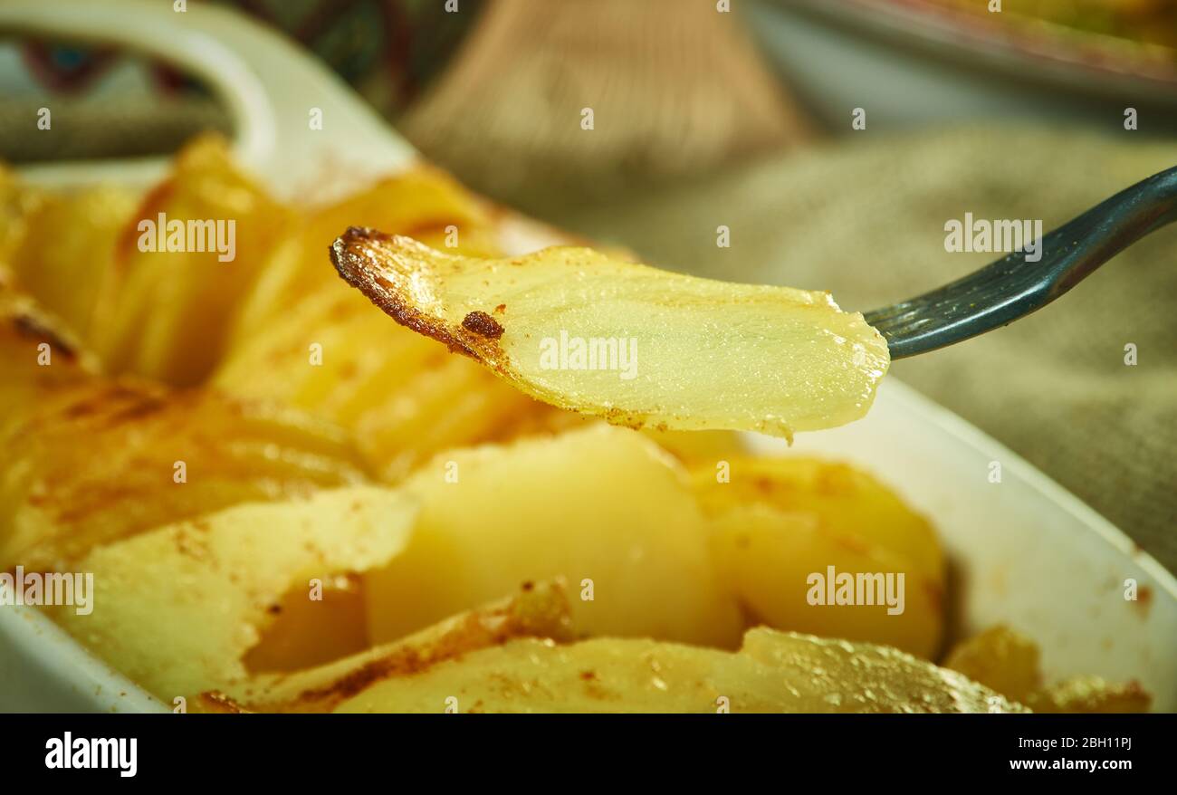 Crispy Leaf Potatoes -Best Roasted Potatoes Ever, sliced potatoes in a ...
