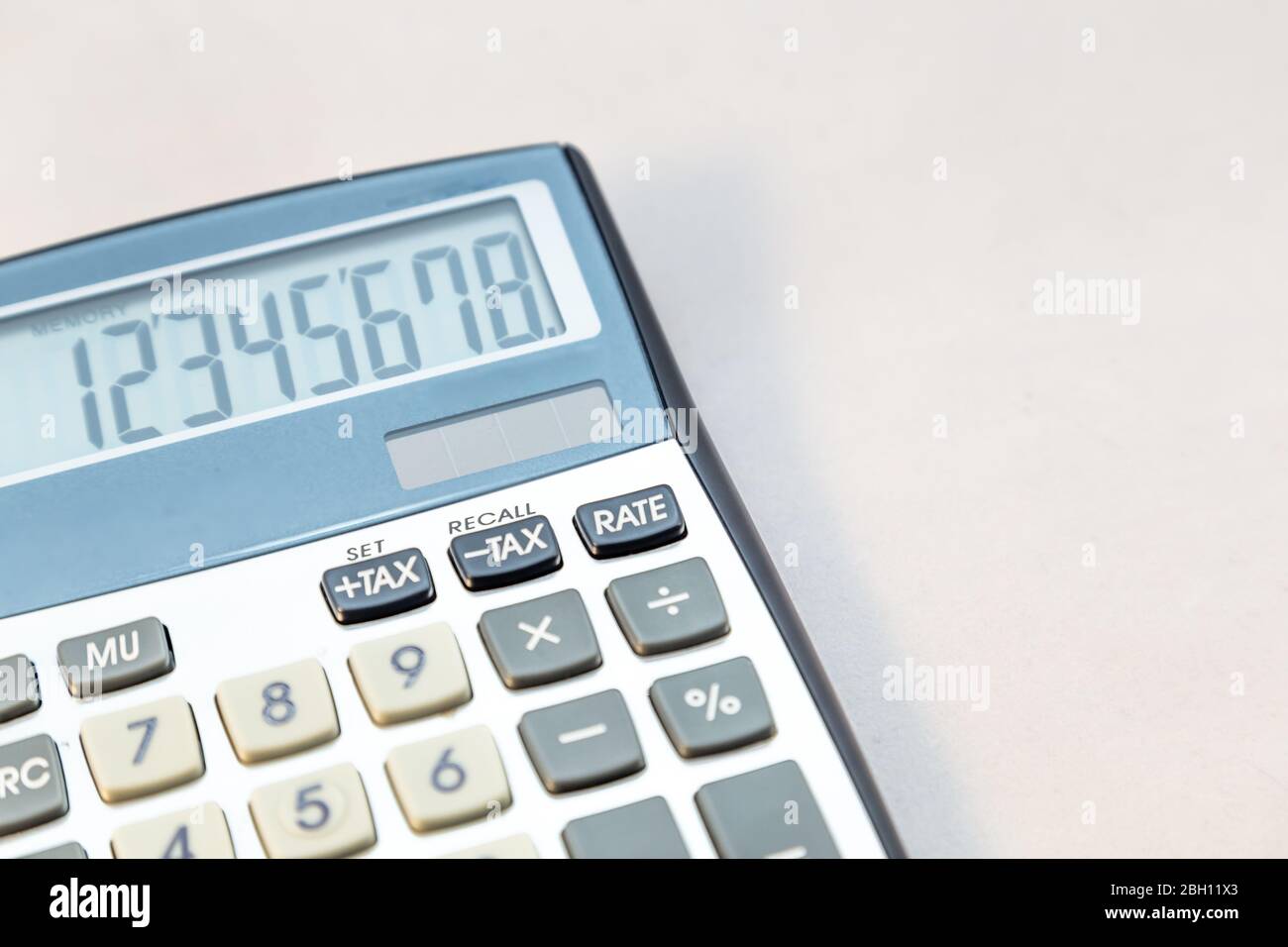 Old electronic calculator on white background Stock Photo - Alamy