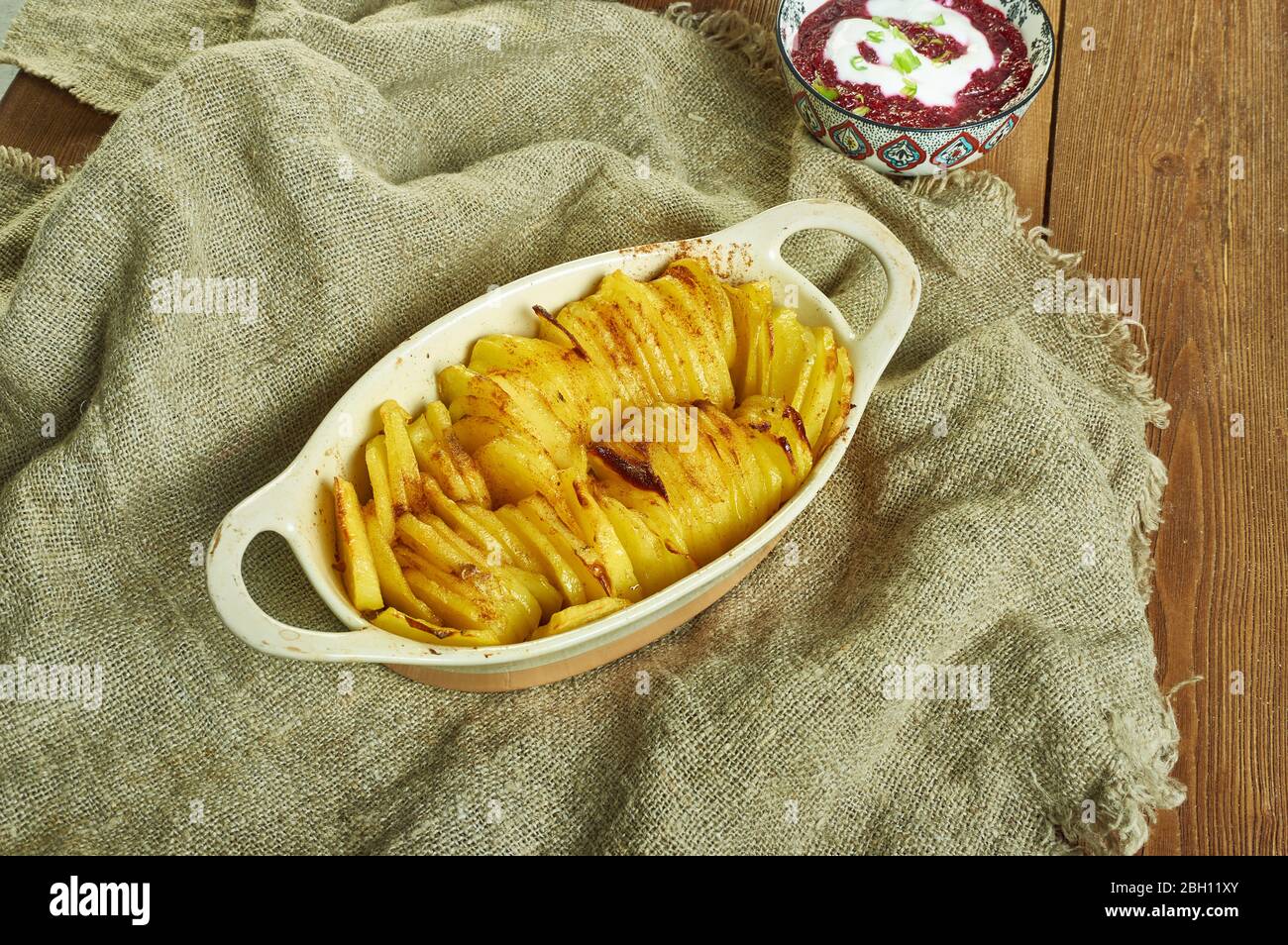 Crispy Leaf Potatoes -Best Roasted Potatoes Ever, sliced potatoes in a ...