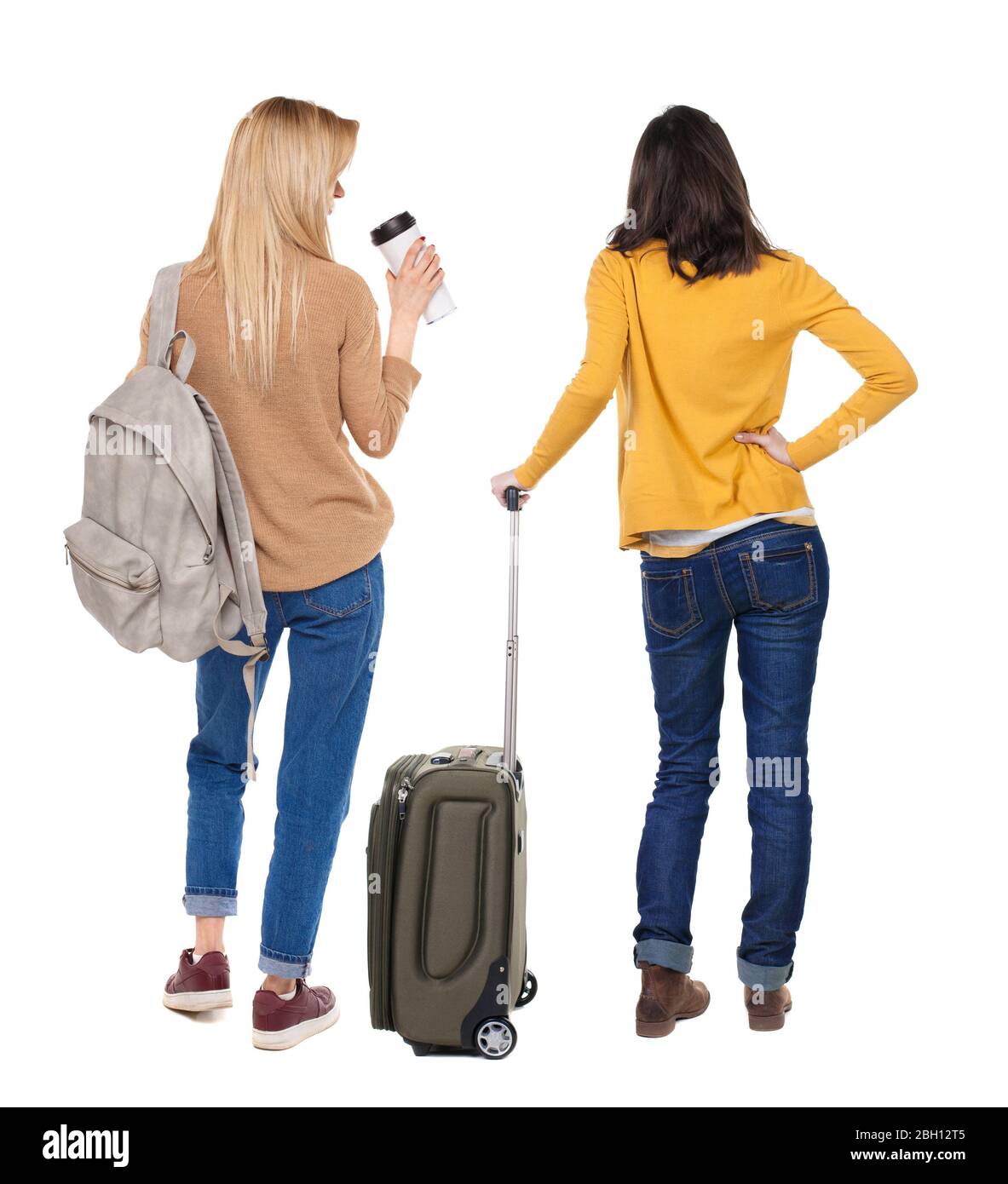 Back view of two woman in sweater traveling with suitcas. Back view ...