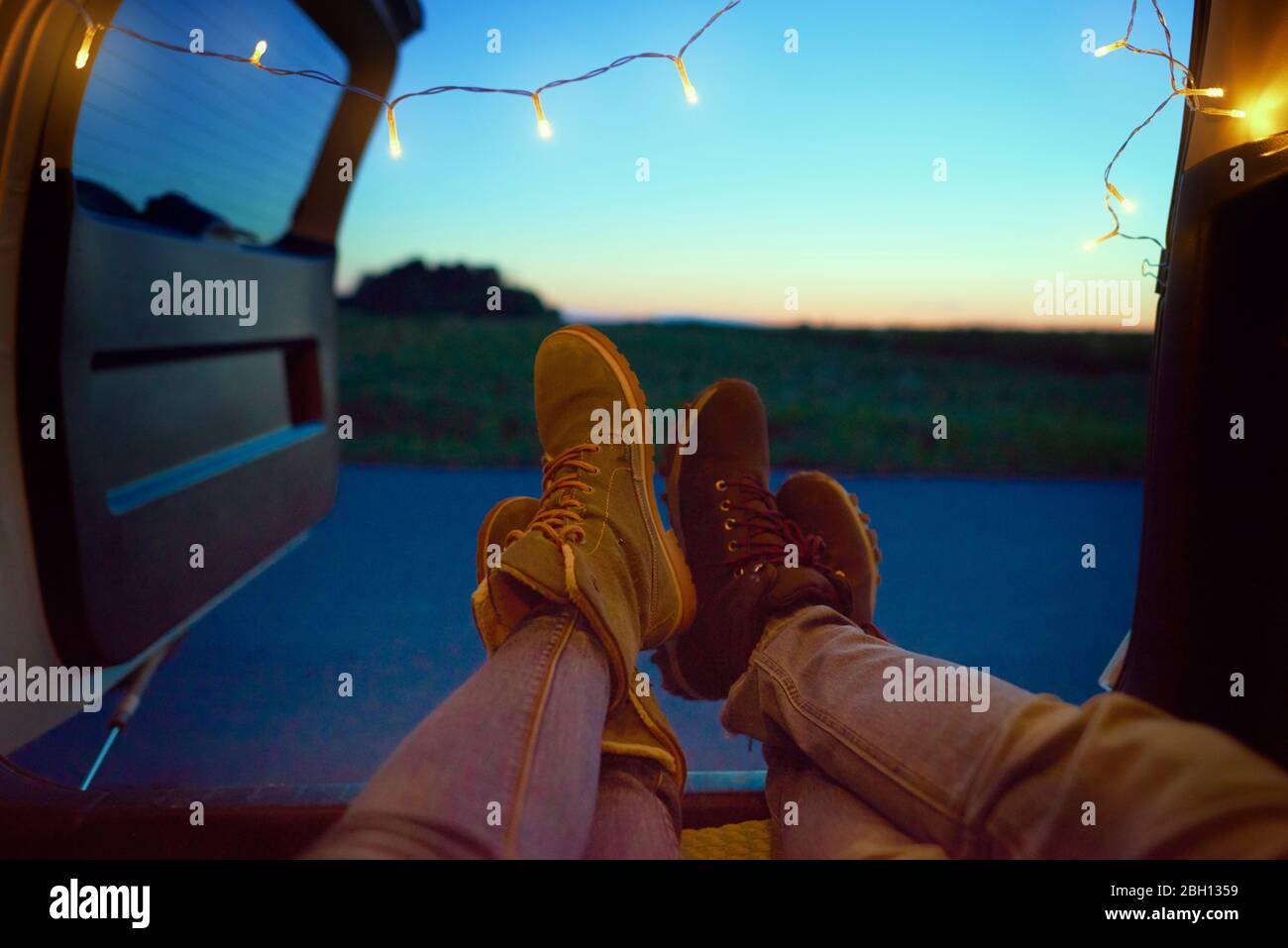 Close up of couple’s legs in a car Stock Photo - Alamy