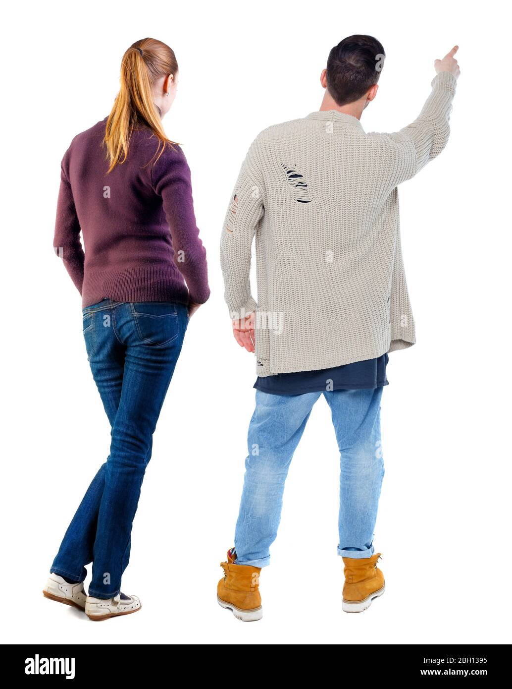 Back view of couple in sweater pointing. Rear view people collection ...
