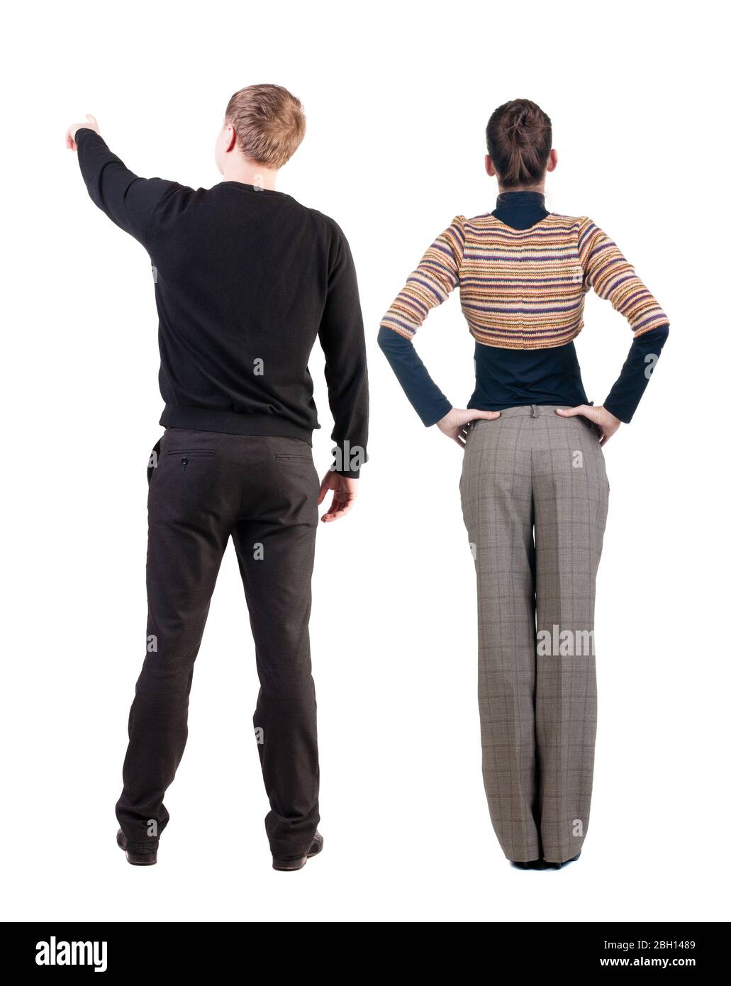 Back view of couple in sweater pointing. Rear view people collection ...