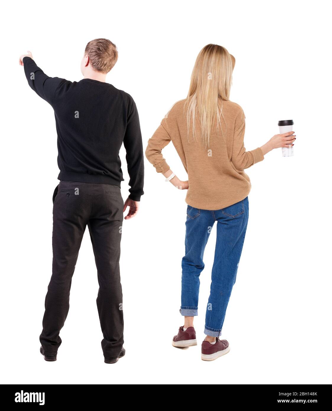 Back view of couple in sweater pointing. Rear view people collection ...