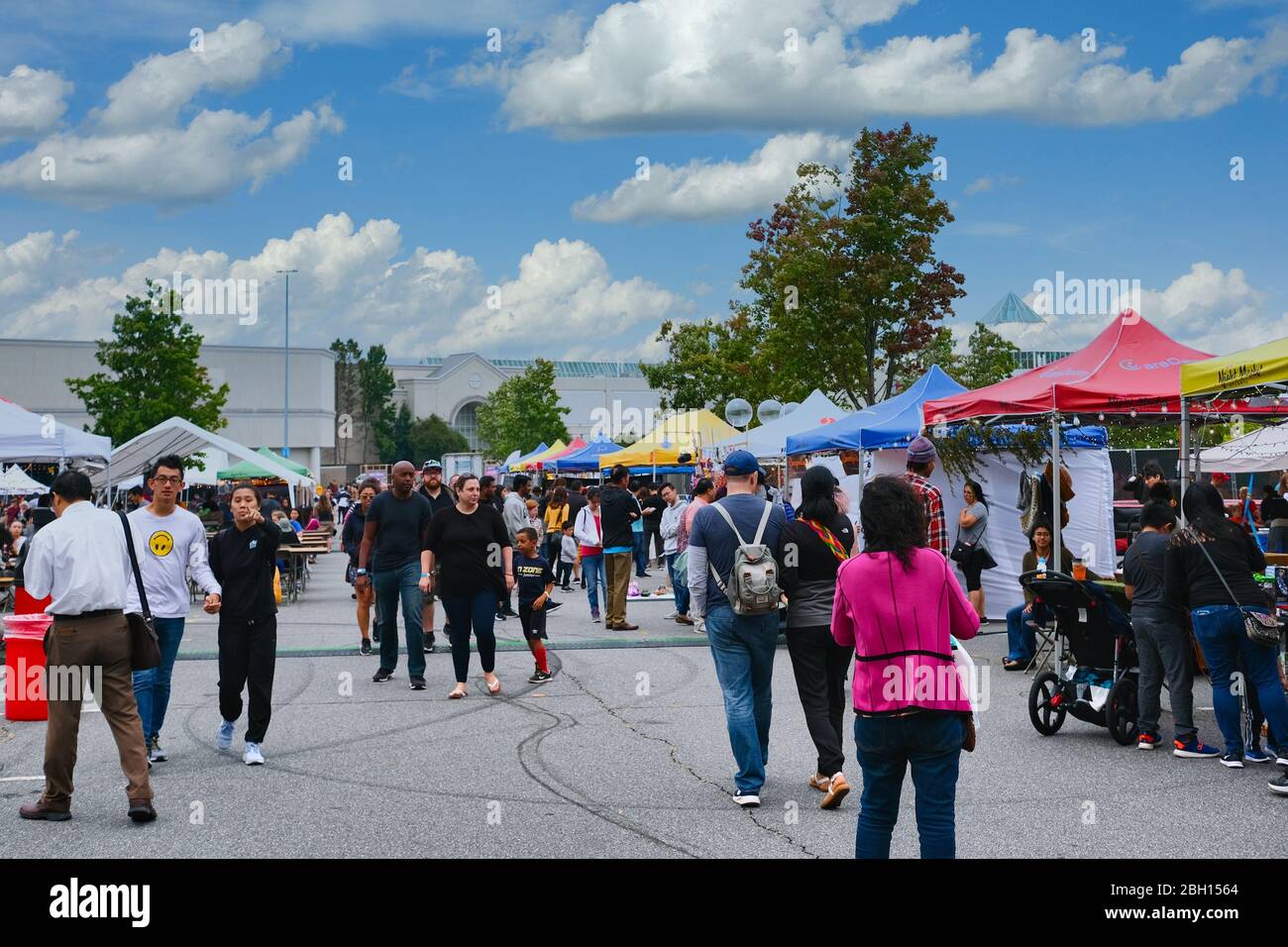 People Enjoying Booths at a Night Market Stock Photo - Alamy