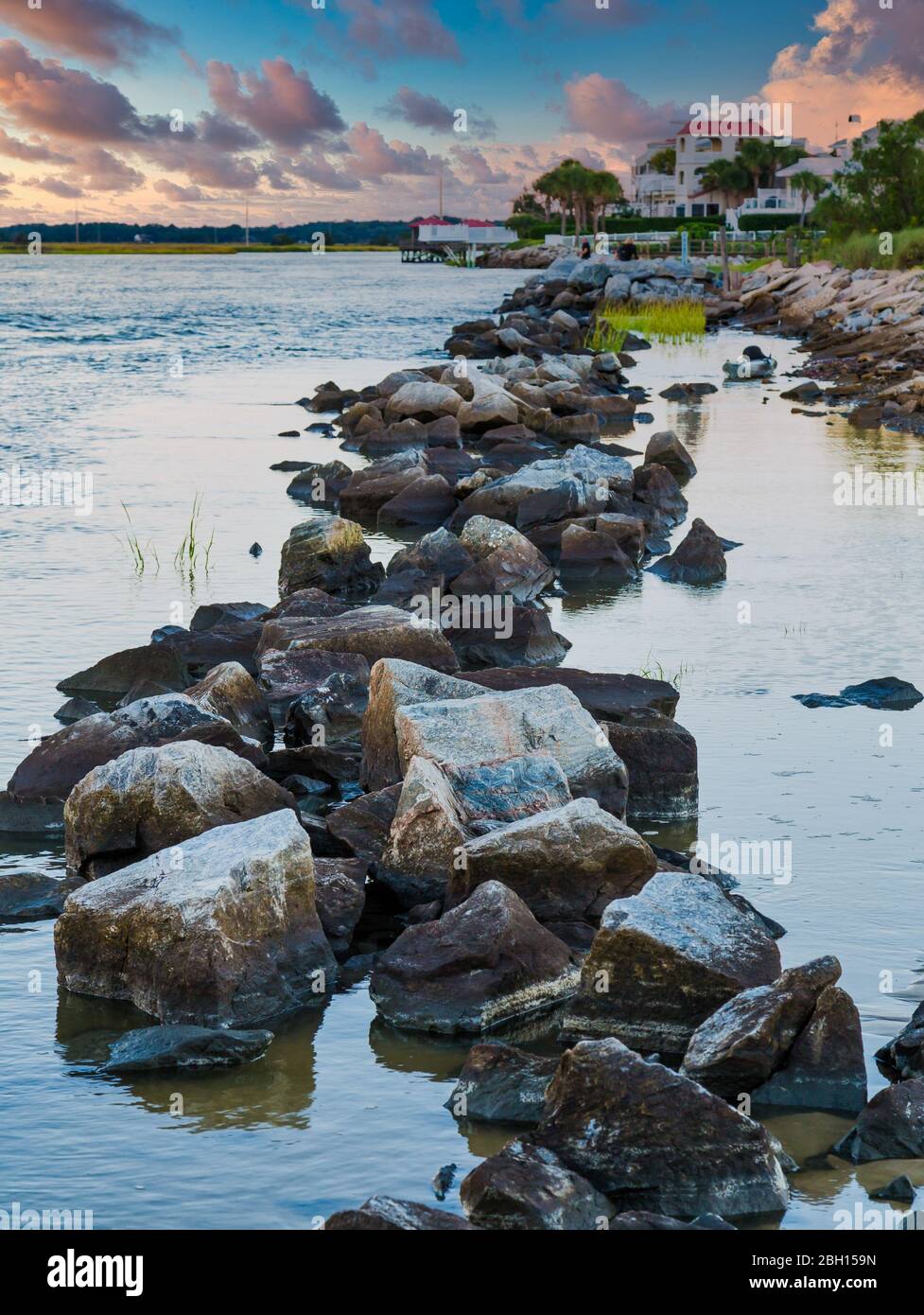 Rocks Along Shore at Sunset Stock Photo - Alamy
