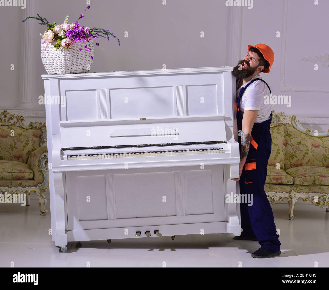 Courier delivers furniture, move out, relocation. Heavy loads concept ...