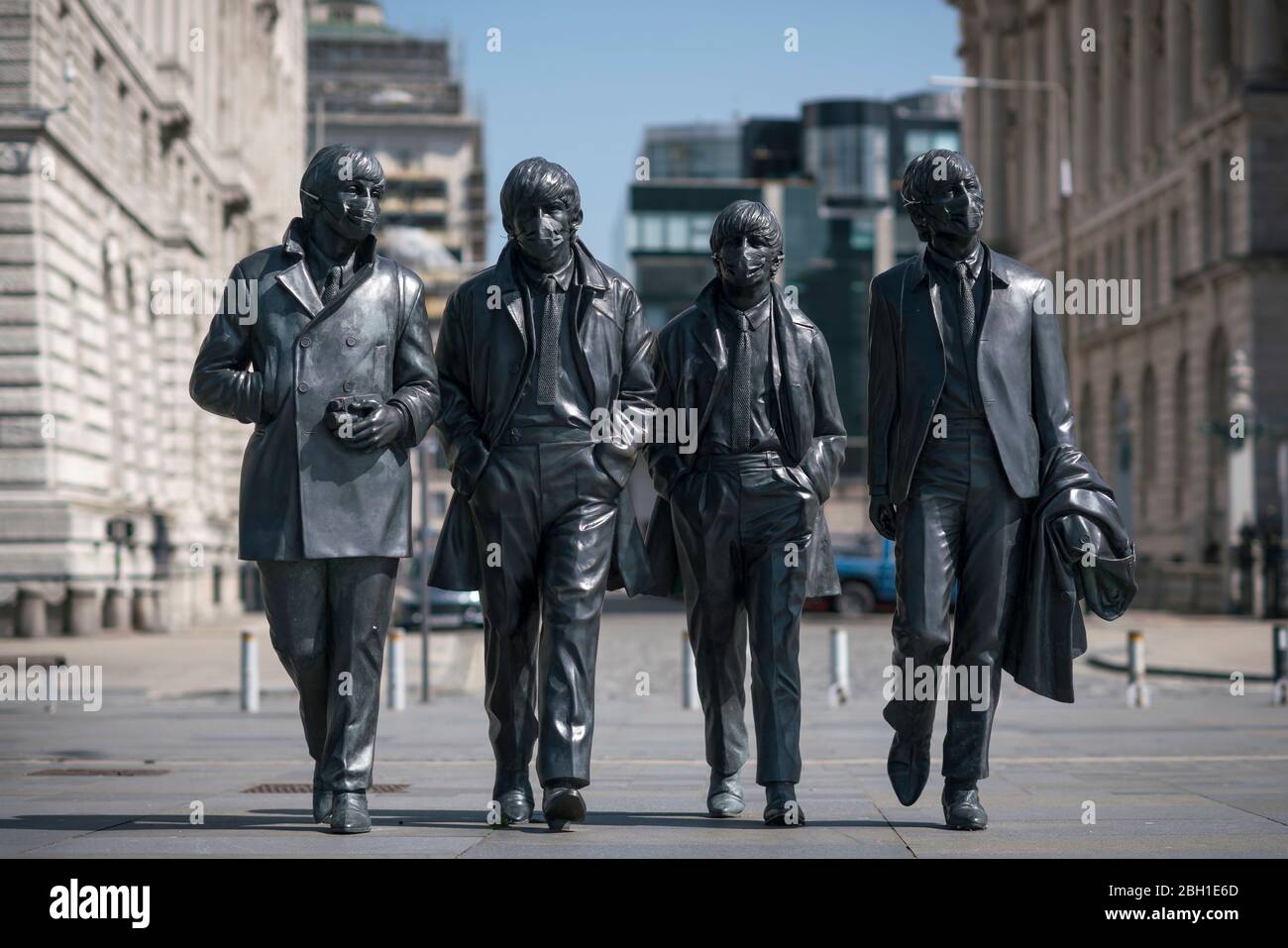 The Beatles statue with face masks Stock Photo - Alamy