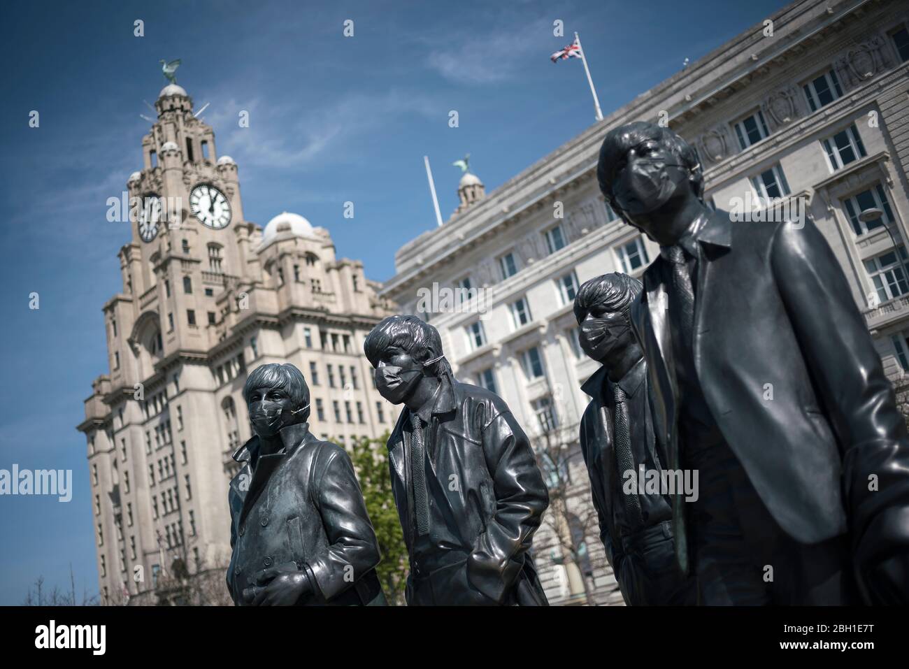 The Beatles statue with face masks Stock Photo - Alamy