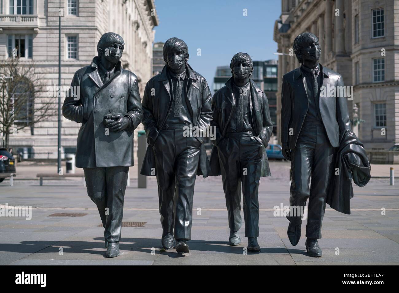 The Beatles statue with face masks Stock Photo - Alamy