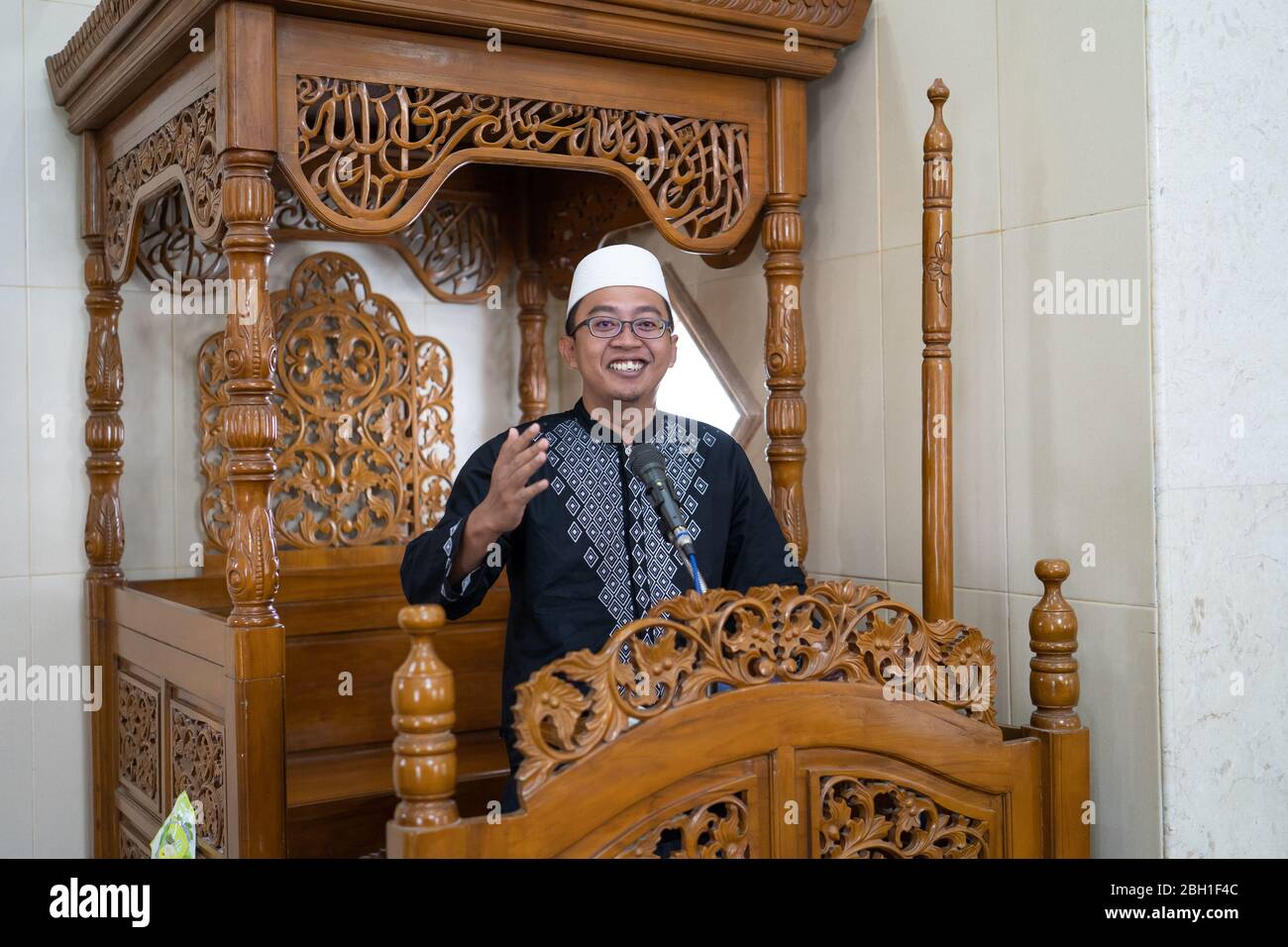 portrait of muslim male preacher sharing about islam during prayer time ...