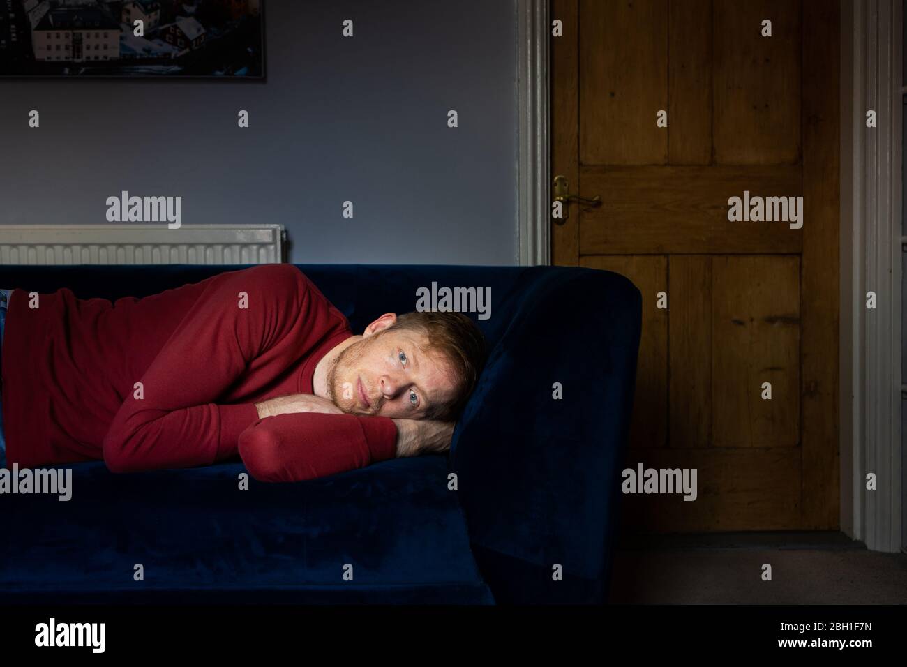 Laying on sofa hi-res stock photography and images - Alamy