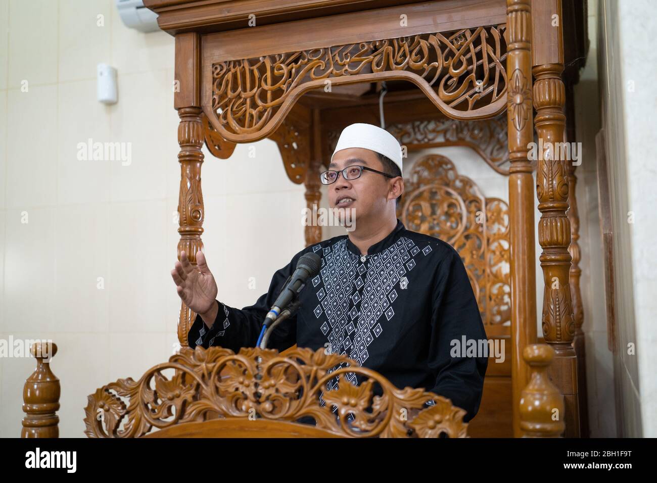 portrait of muslim male preacher sharing about islam during prayer time ...