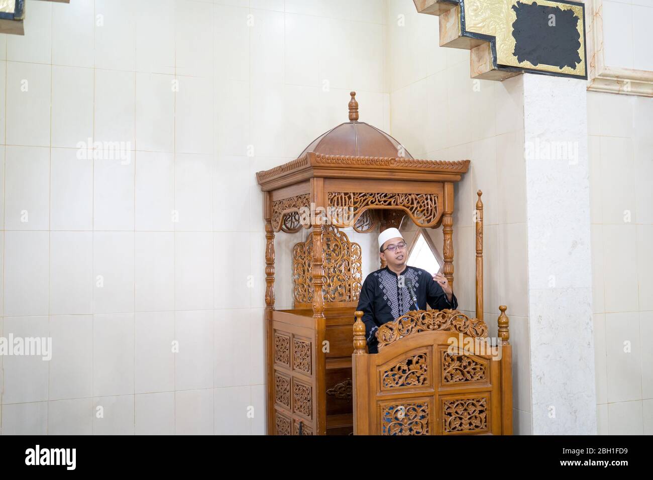 portrait of muslim male preacher sharing about islam during prayer time ...