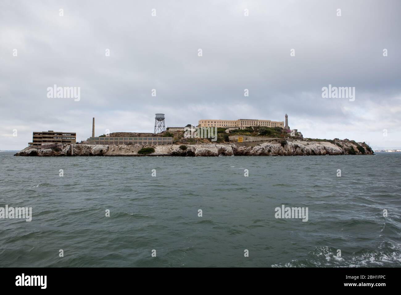 Alcatraz Island Penitentiary prison viewed from a boat in San Francisco ...