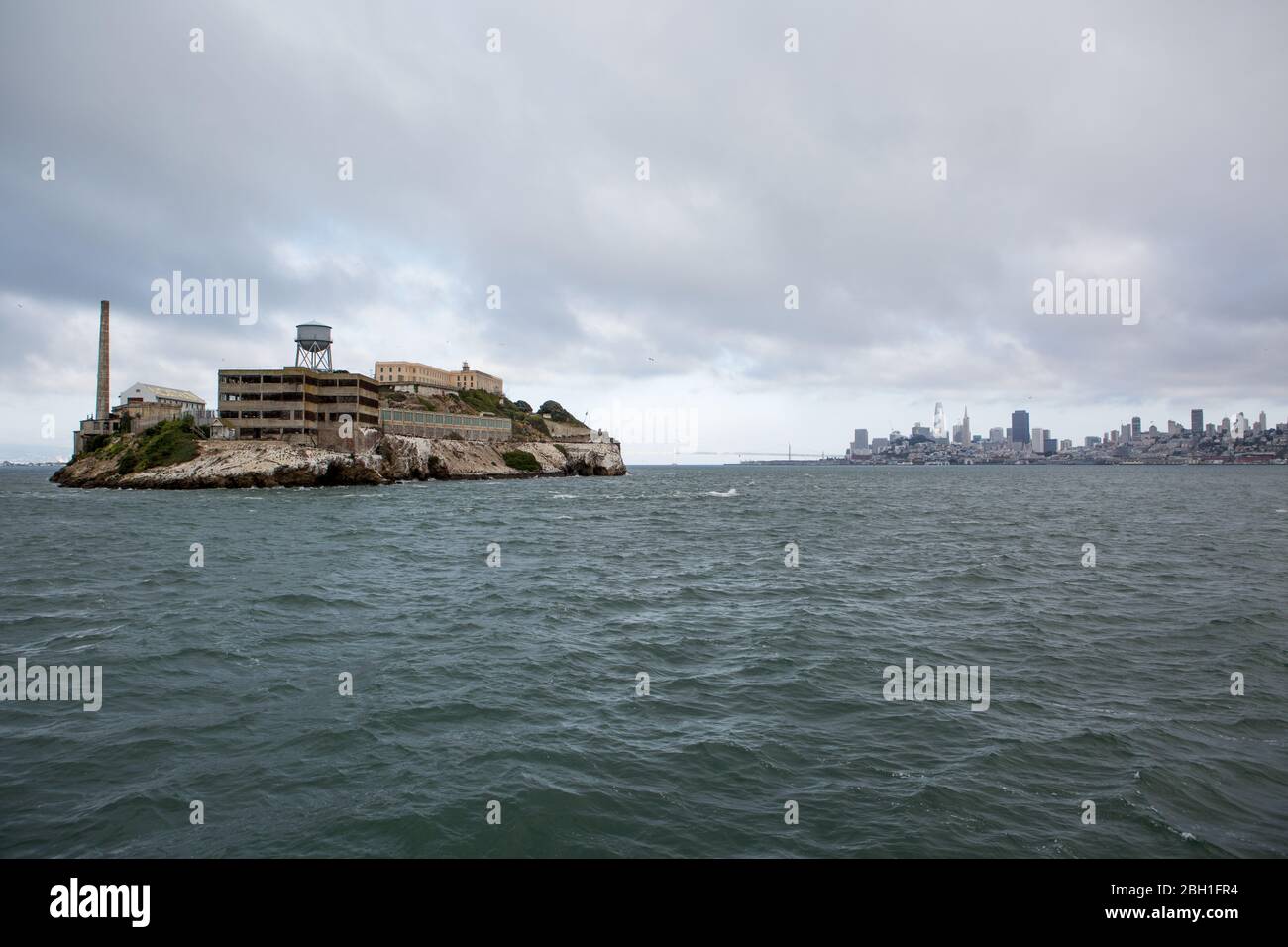 Alcatraz Island Penitentiary prison viewed from a boat in San Francisco ...