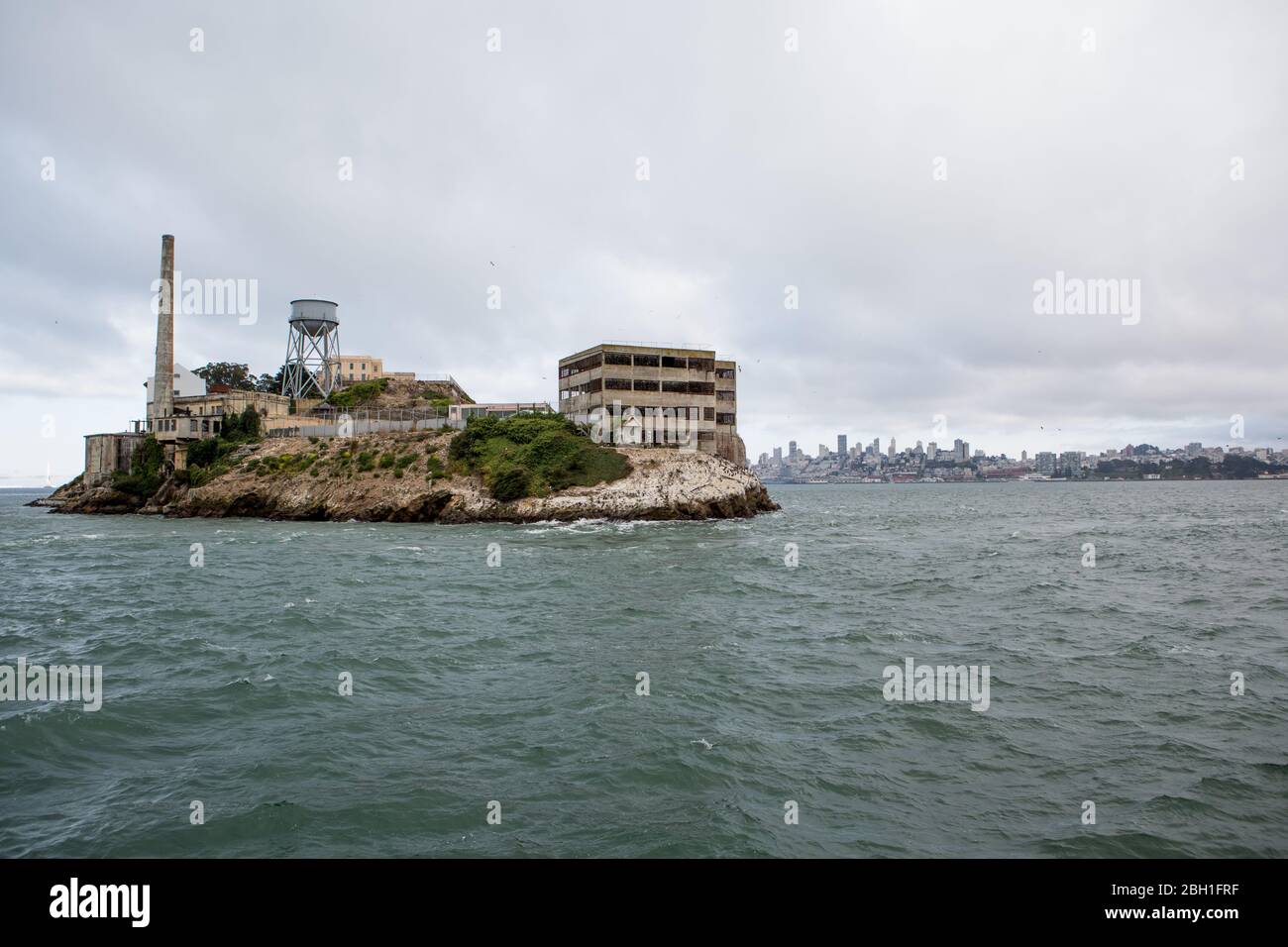 Alcatraz Island Penitentiary prison viewed from a boat in San Francisco ...