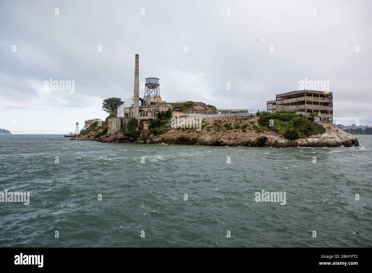 Alcatraz Island Penitentiary prison viewed from a boat in San Francisco ...