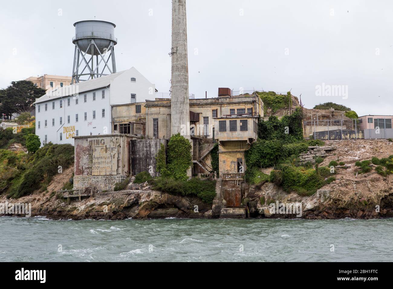 Alcatraz Island Penitentiary prison viewed from a boat in San Francisco ...