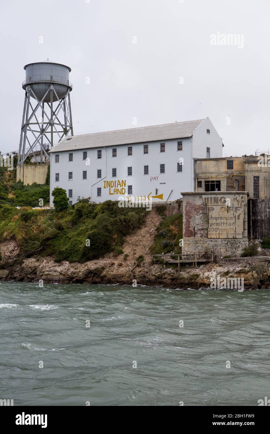 Alcatraz Island Penitentiary prison viewed from a boat in San Francisco ...