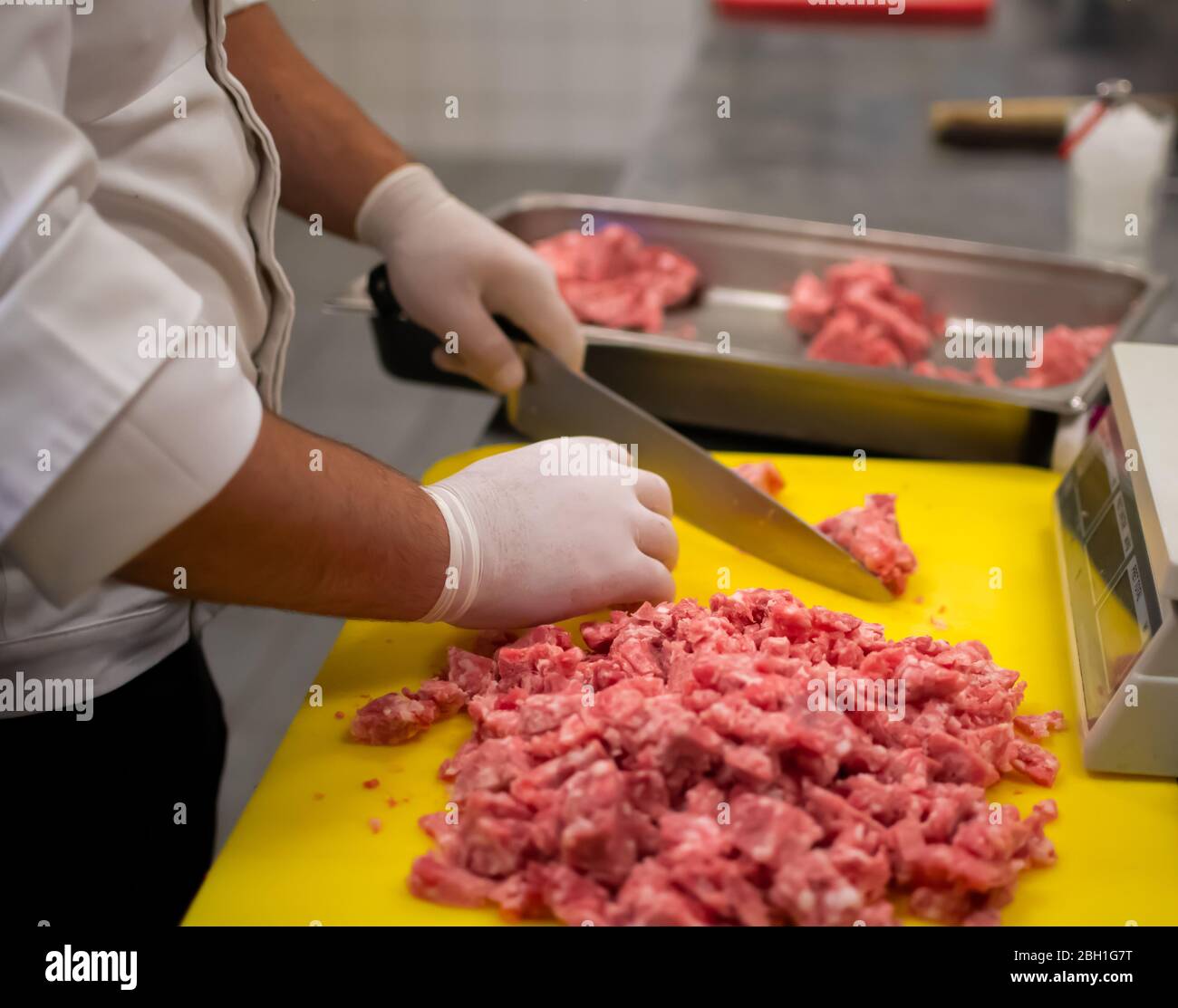 Chef cook preparing meatloaf composition at the grinder machine Stock ...